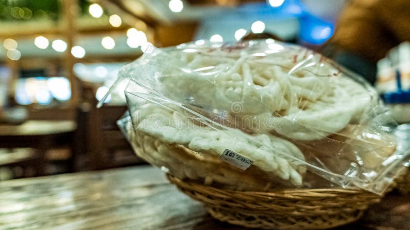 Java Traditional White Crackers Wrapped in Plastic on a Wooden Table ...