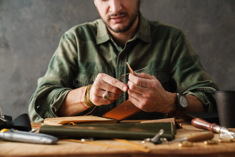 White Craftsman Sewing while Making Leather Wallet Stock Image - Image ...