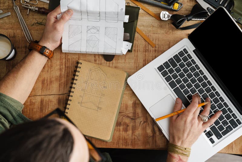 Craftsman Drawing while Working with Leather in Workshop Stock Image ...