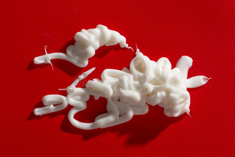 White Cream of Various Shapes on a Red Background Stock Image - Image ...