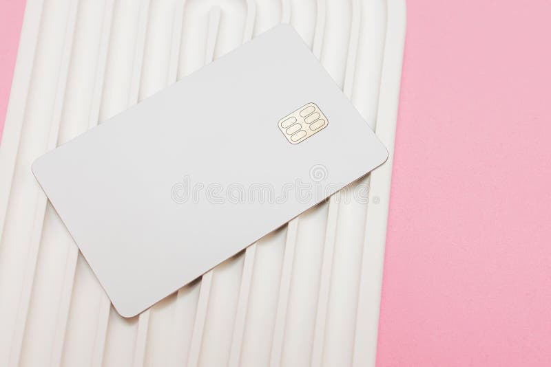 White Credit or Debit Card with Chip on the Wavy White Stone Surface ...
