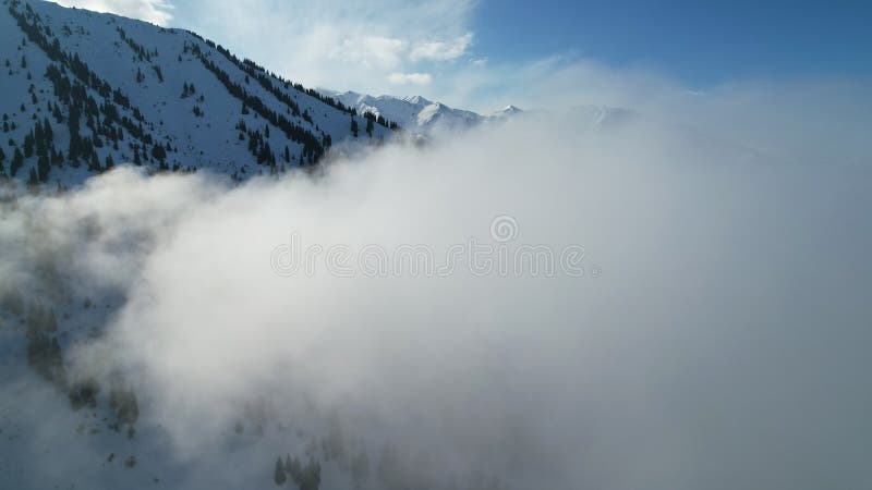 White Cumulus Clouds in Snowy Mountains in Winter Stock Photo - Image ...