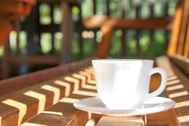 White cup on a brown bench stock image. Image of lifestyle - 44463313