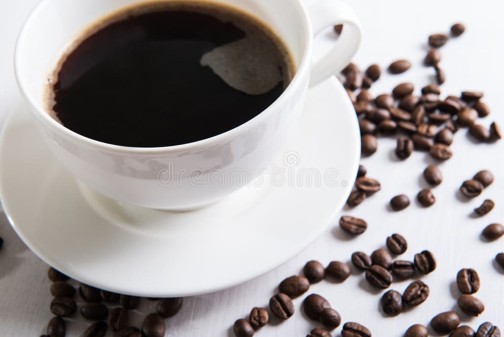 White Cup with Coffee and Coffee Seed on the Table Stock Image - Image ...