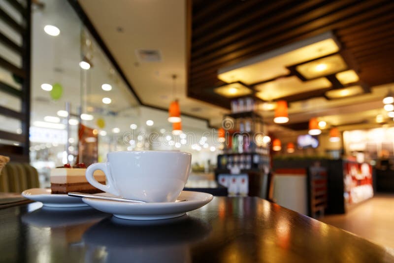 White Cup of Coffee in Coffee Shop Stock Photo - Image of indoors ...
