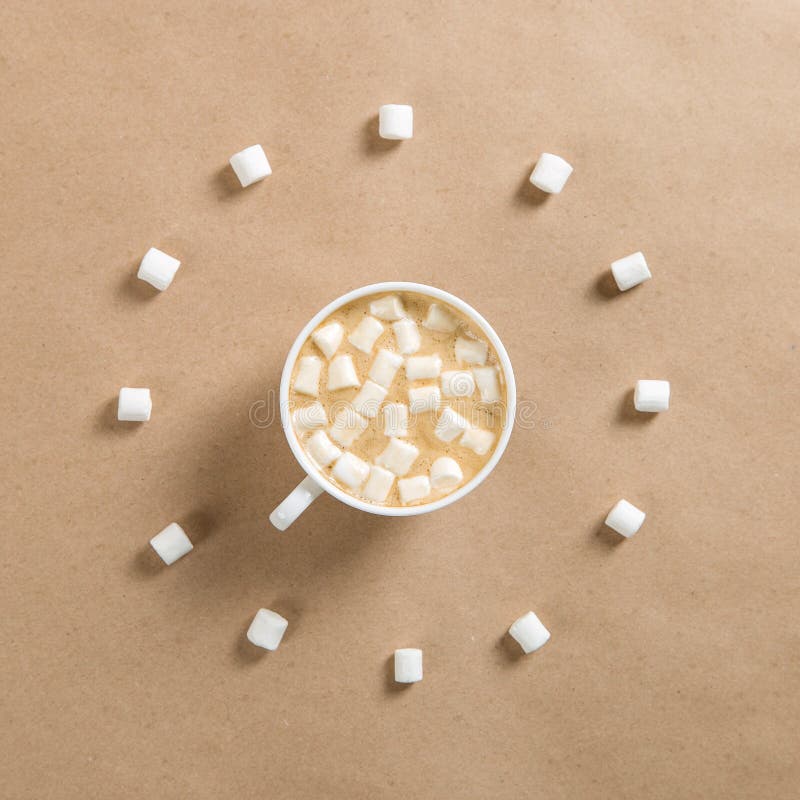 A White Cup of Coffee with Marshmallows on Brown Craft Paper ...