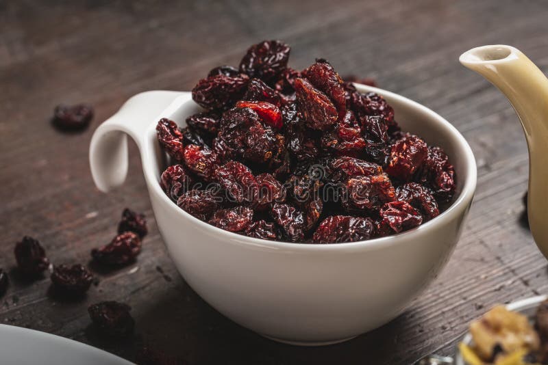 White Cup Full of Dried Red Berries Placed on Dark Board Stock Image ...