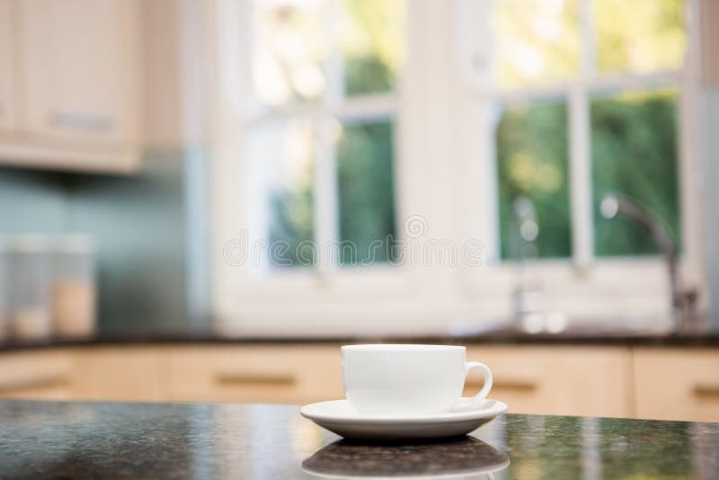White Cup on Kitchen Counter Stock Photo - Image of homey, cooker: 65341158