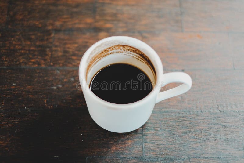 White Cup with the Remains of Coffee Stock Photo - Image of space, wood ...