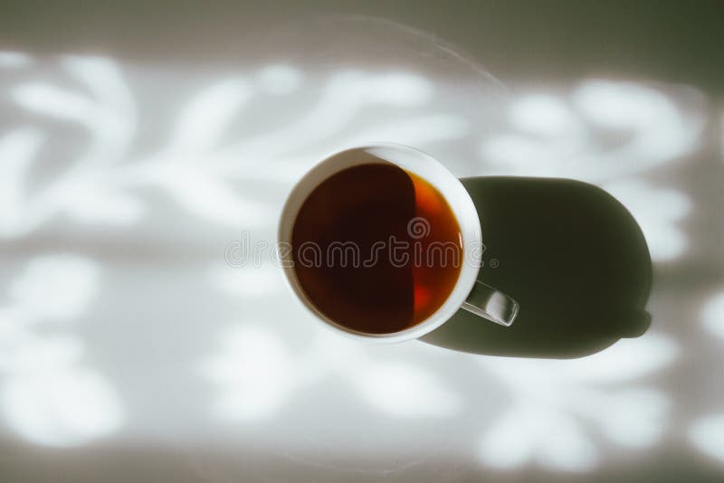 White Cup of Tea on Abstract Background of Natural Curtain Shadow ...