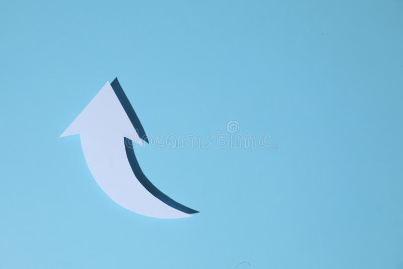 White Curved Paper Arrow on Light Blue Background, Top View. Space for ...