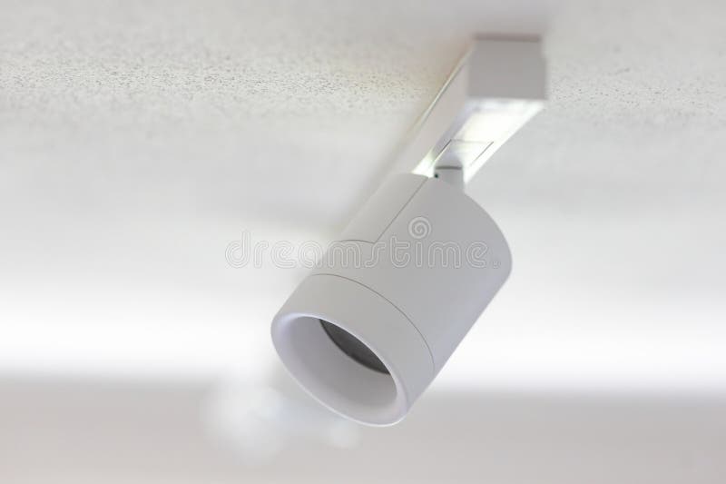 White Cylindrical Ceiling Light Illuminating a Textured Ceiling Stock ...