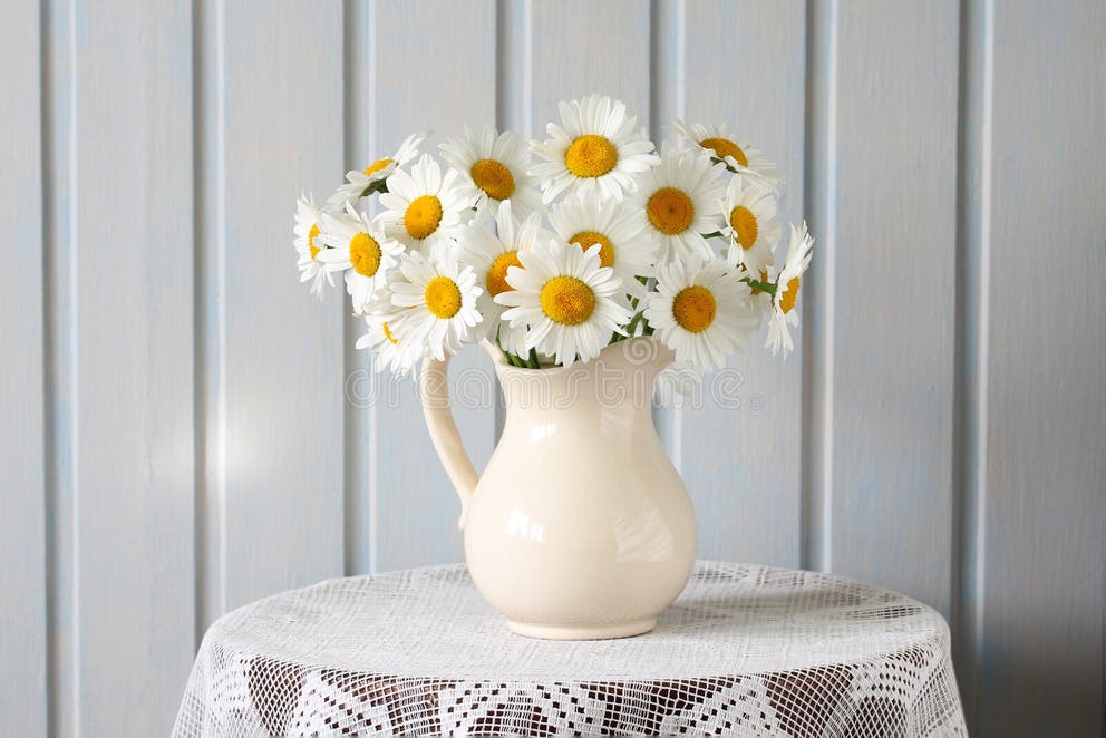 Daisies in a Jug on a Table with a Retro Tablecloth Stock Image - Image ...
