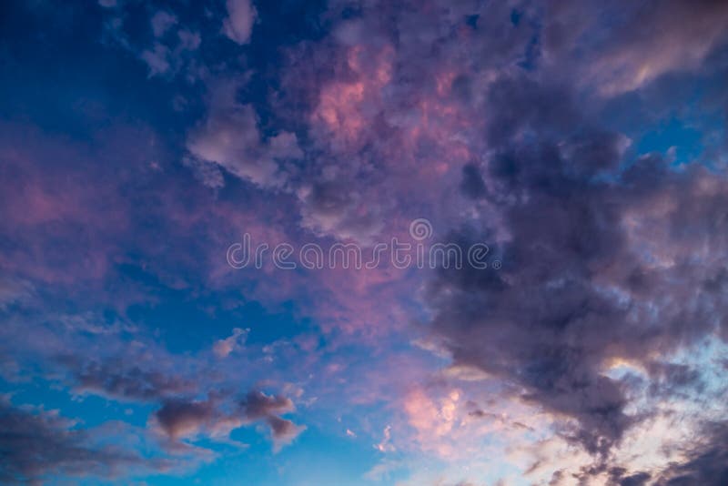 White and Dark Clouds Colored Pink on Blue Sky during Sunset Stock ...
