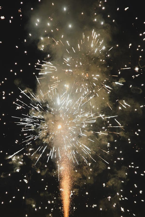 White Dash and Dot Backyard Fireworks with Red Spray, Close-up Stock ...