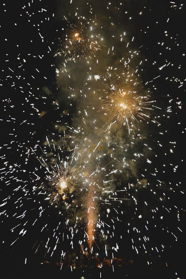 White Dash and Dot Backyard Fireworks with Red Spray Stock Photo ...