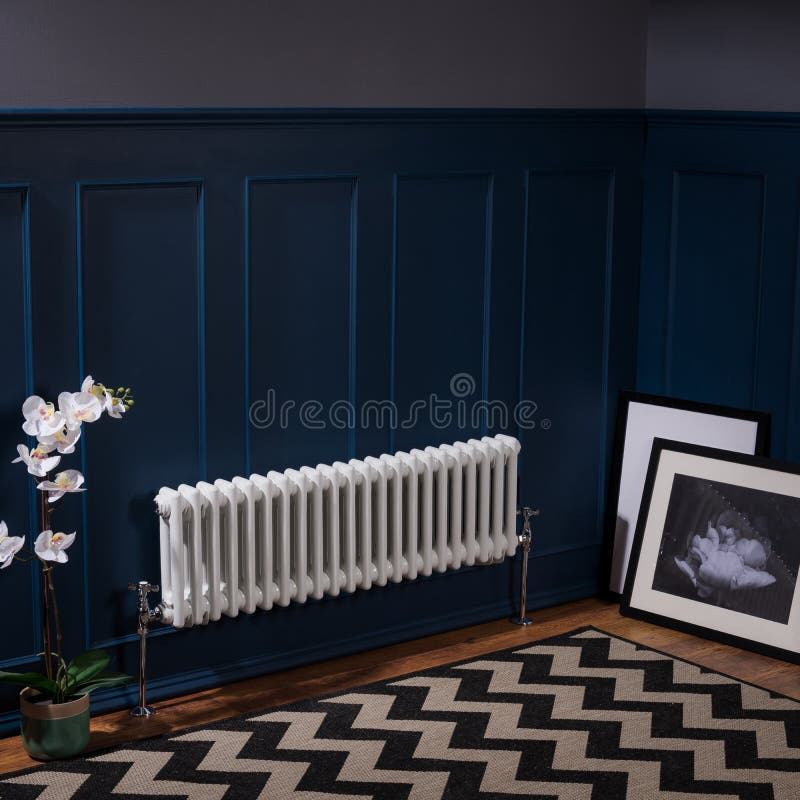 White Decorative Heater in a Renovated Modern Blue Room Stock Photo ...