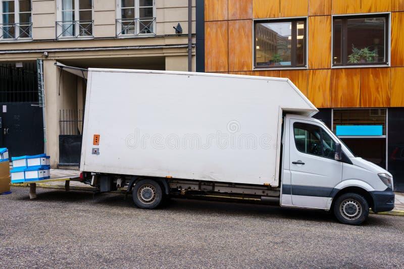 White Delivery Truck Parked in Front of Building Editorial Stock Image ...