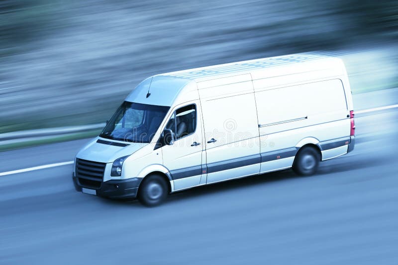 White delivery van on road stock image. Image of driving - 220568497