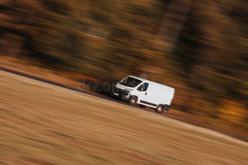 White Delivery Van on the Road in the Speed Editorial Stock Photo ...