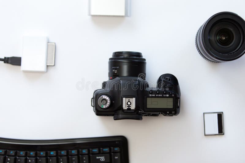 White Desk with a Professional Camera and Accessoires Stock Photo ...