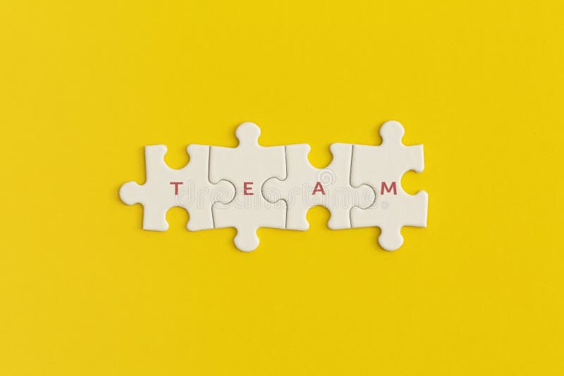 White Details of Puzzle with the Word TEAM on Yellow Background Stock ...