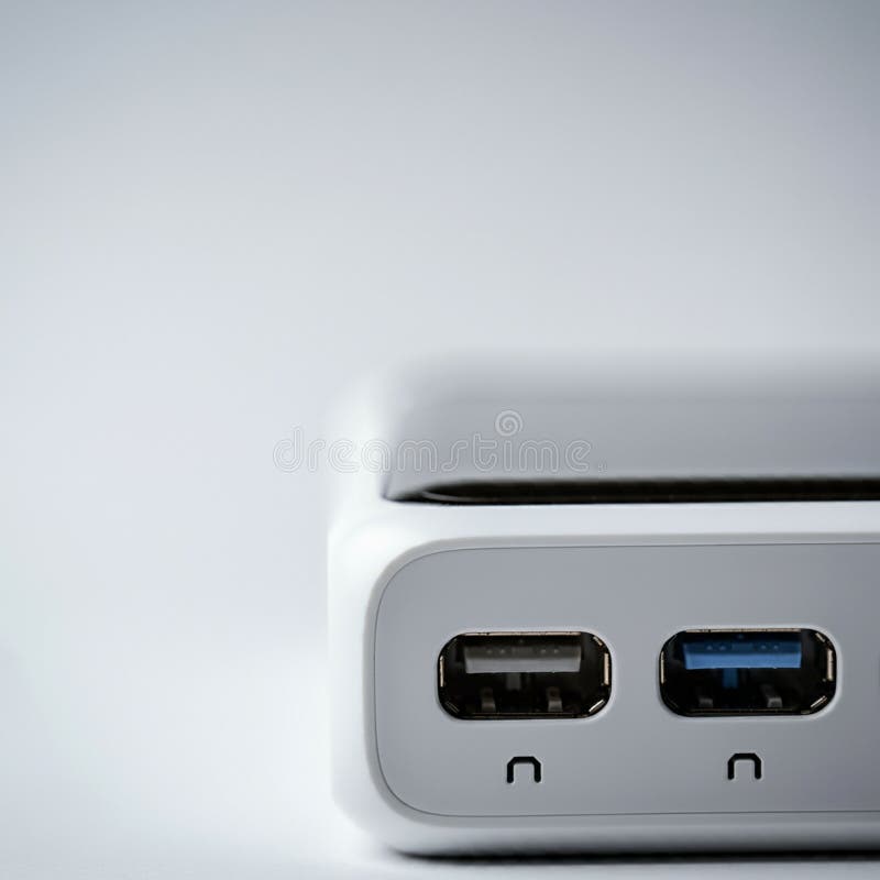 White Device with Two USB Ports on Its Front Panel Against a Light ...