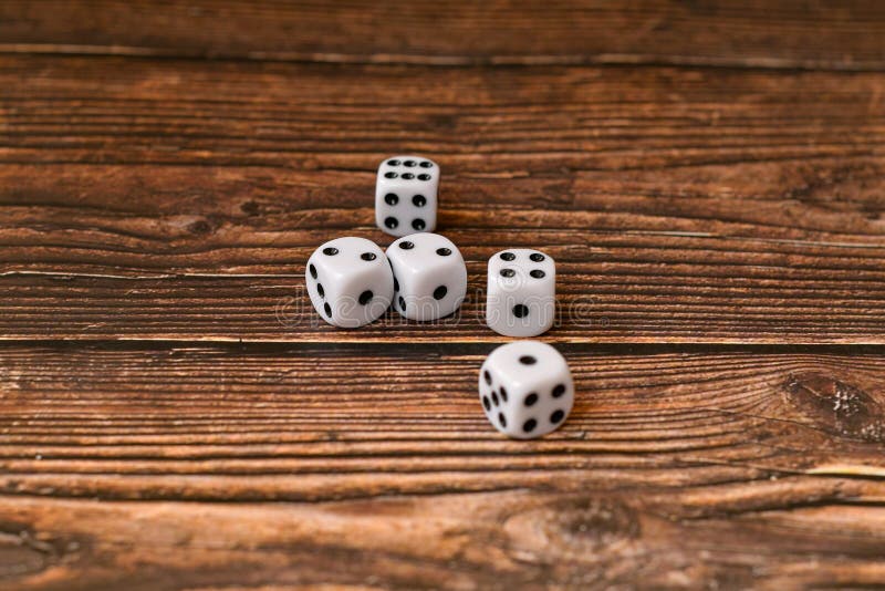 White Dice are Scattered on a Wooden Texture. Casino and Gambling ...