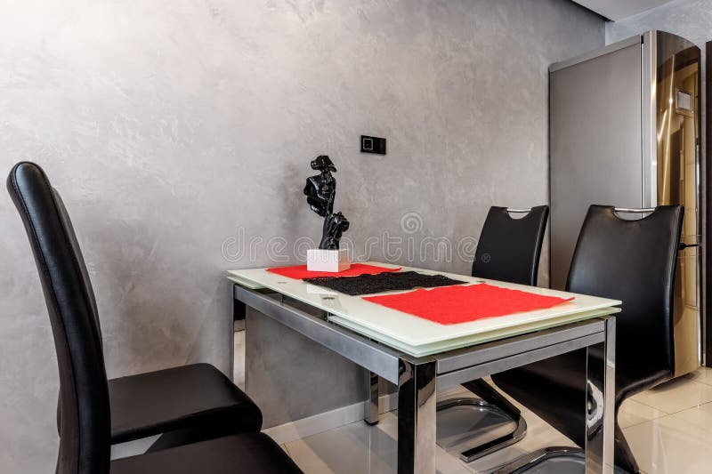 White Dining Table in the Kitchen with Black Chairs Standing Next To ...
