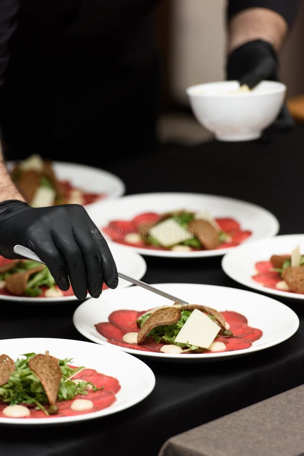 White Dish with Carpaccio of Beef. the Chef is Preparing To Serve a ...