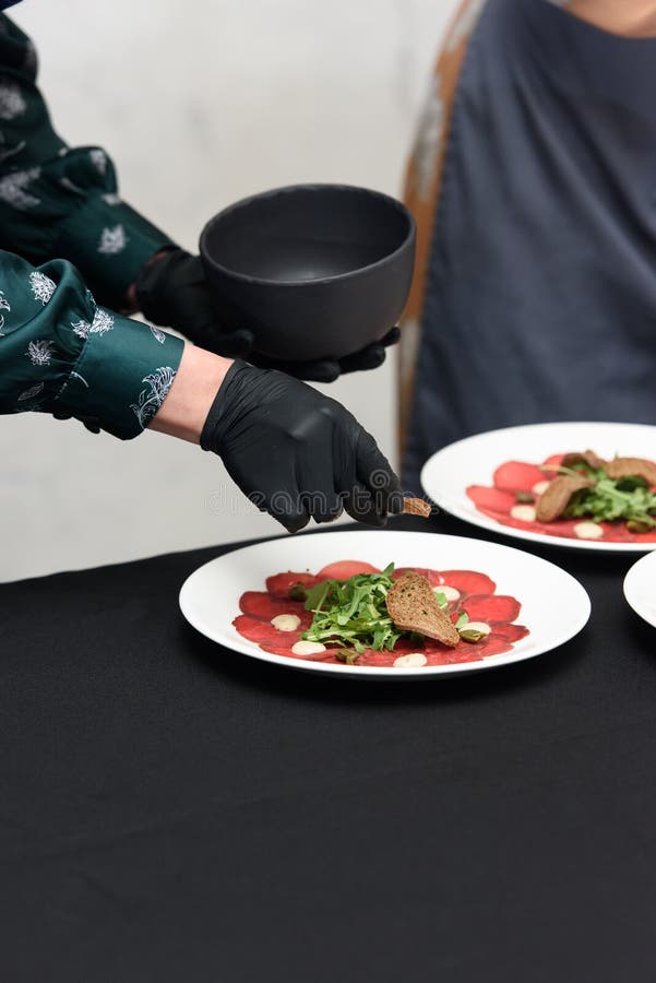 White Dish with Carpaccio of Beef. the Chef is Preparing To Serve a ...