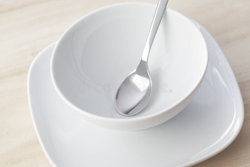 White dishes and spoon stock image. Image of wood, dish - 21761339