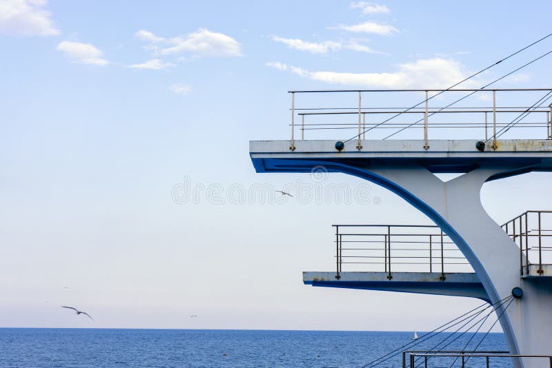 White Diving Board or Tower Against a Clear Blue Sky. in the Background ...