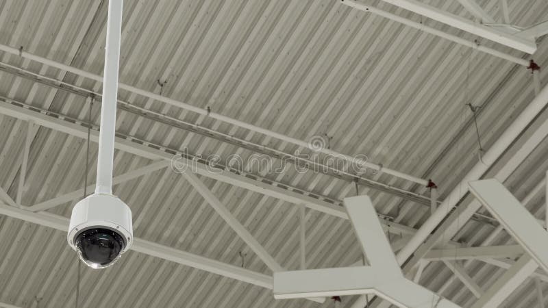 A White Dome Camera Mounted on a Ceiling. CCTV Security Cam Stock ...