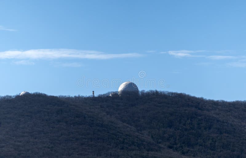 White Dome of the Observatory on a Mountain in the Forest Against the ...