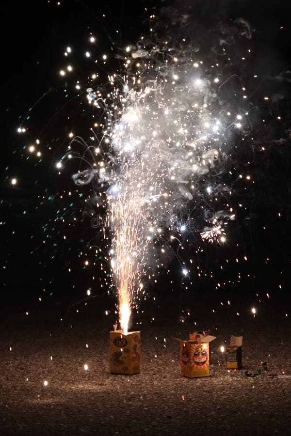 White Dot and Red Spray Fireworks on Cement Stock Photo - Image of ...