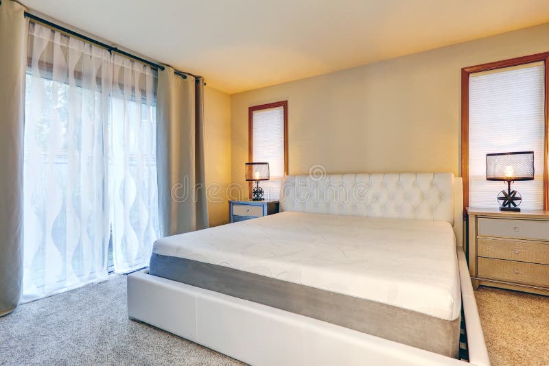 White Double Bed Front View, with Two Lamps on Bedside Tables. Stock ...