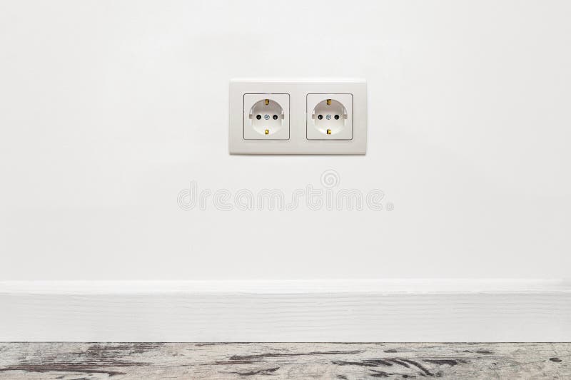 White Double Outlet on White Wall Stock Photo - Image of flooring ...