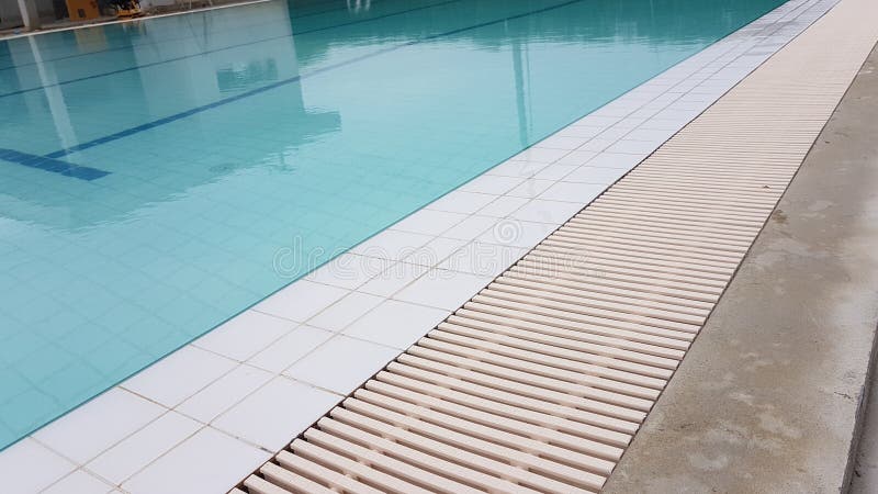 White Drainage Rail with White Tile beside the Swimming Pool Stock ...