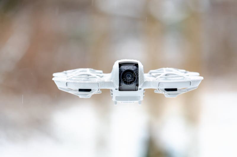 A White Drone with a Camera on it is Flying in the Air Stock Image ...
