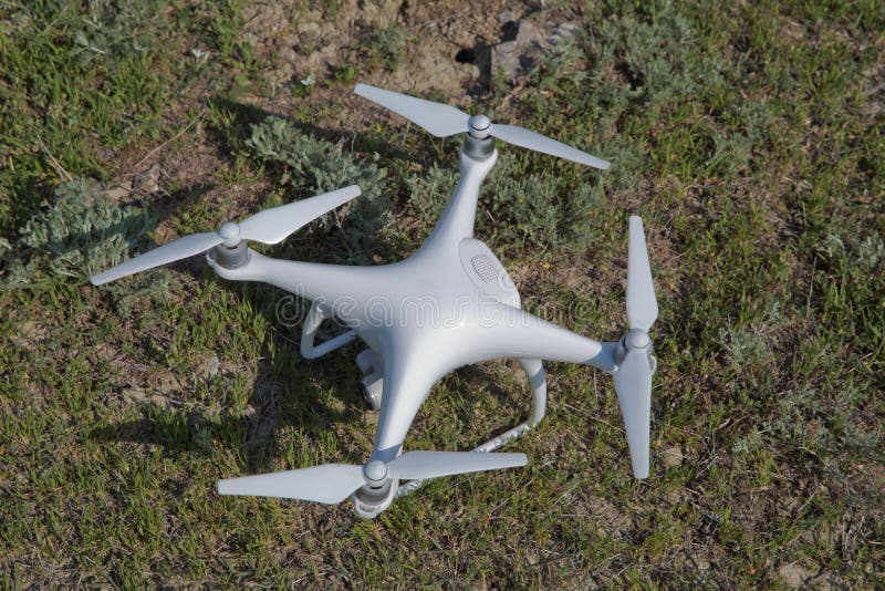 White Drone with Digital Camera Flying in Sky Over Mountain Drone with ...