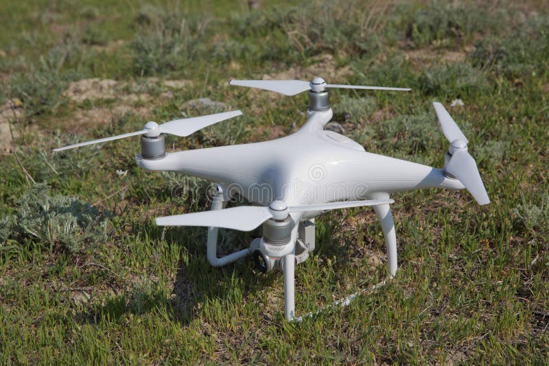 White Drone with Digital Camera Flying in Sky Over Mountain Drone with ...