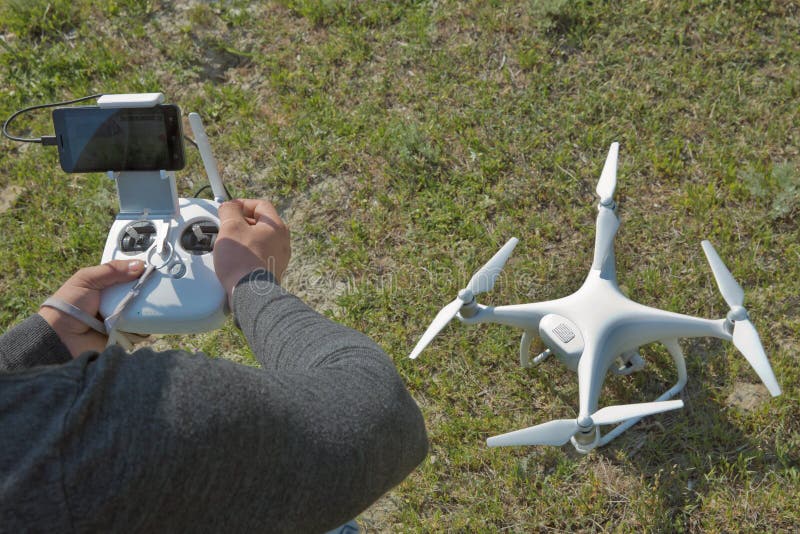White Drone with Digital Camera Flying in Sky Over Mountain Drone with ...