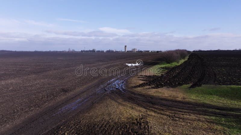 The White Drone Films and Scans the Surface of Open Fields. the Drone ...
