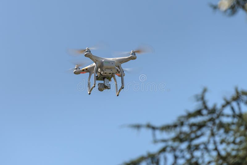 White drone in flight stock photo. Image of delivery - 94851022