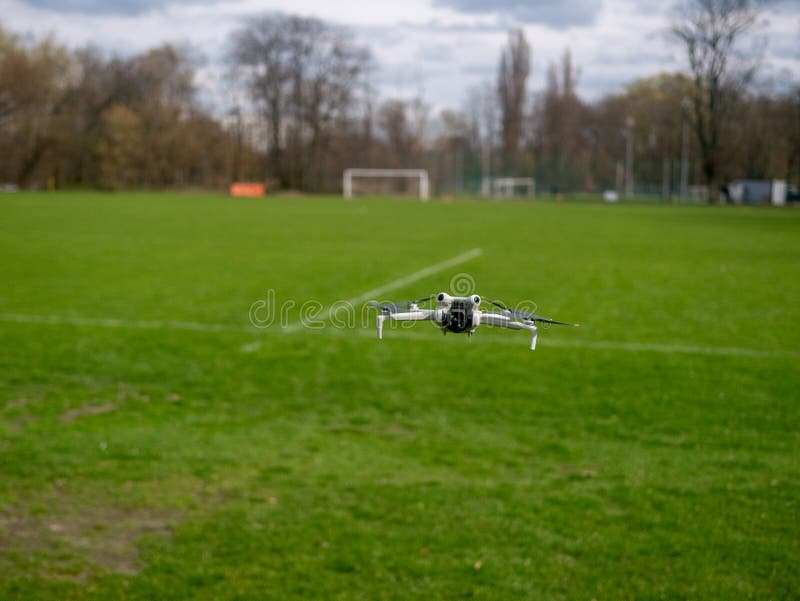 White Drone is Flying Over a Green Field Stock Photo - Image of lush ...