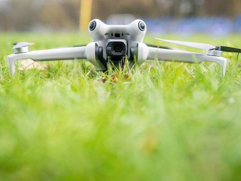 White Drone is on the Grass Stock Image - Image of field, flying: 371855665