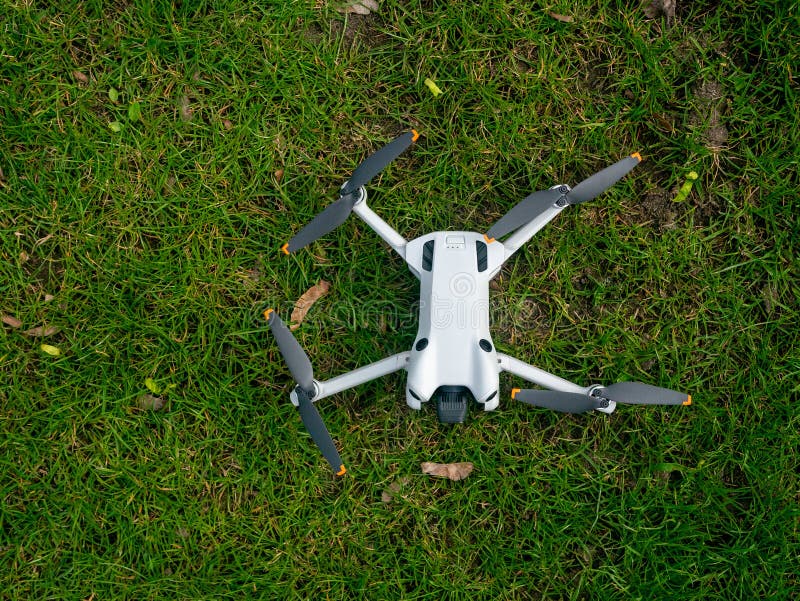 White Drone is on the Grass Stock Image - Image of grass, camera: 371857065