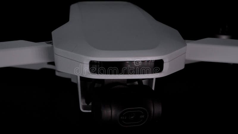 Front View of White Drone Against Black Background in Studio Lighting ...
