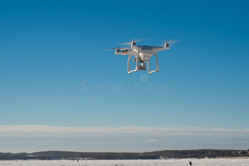 White Drone Quad Copter with Flying in the Blue Sky Stock Image - Image ...